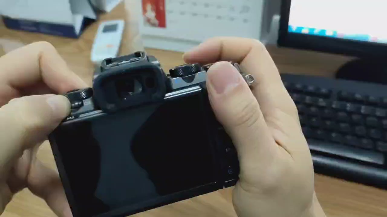 Push and hold the lens switch in direction and rotate the lens to enab